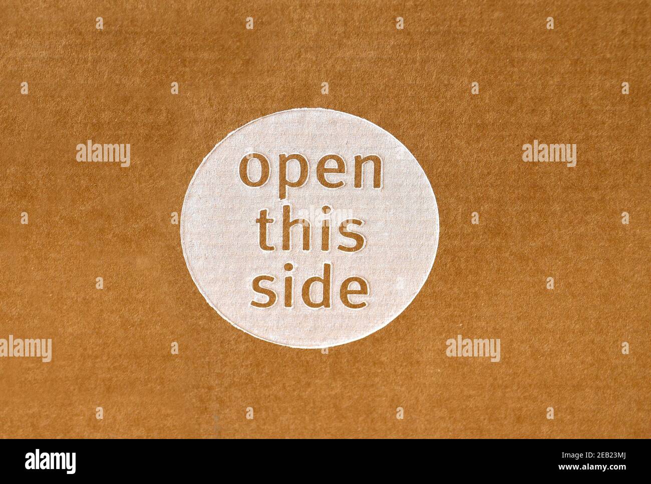 "Open this side" printed on the side of a cardboard box Stock Photo - Alamy