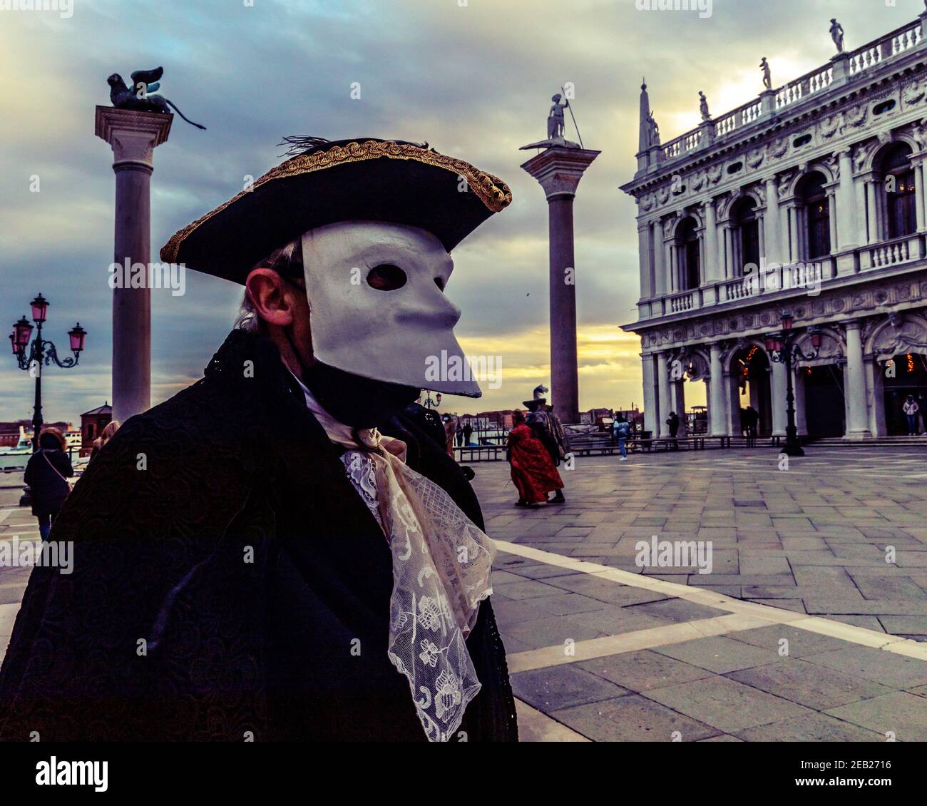 Traditional Bauta costume with cape, feathered tricornered hat and ...