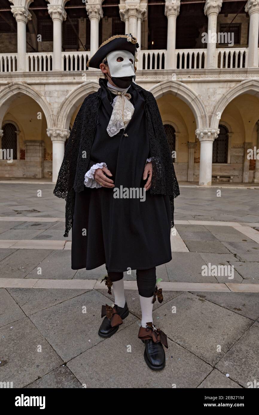 Traditional Bauta costume with cape, feathered tricornered hat and ...