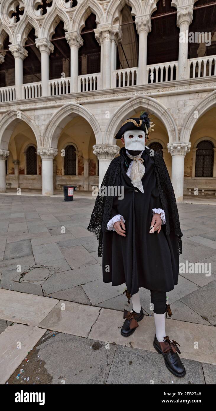 Traditional Bauta costume with cape, feathered tricornered hat and ...