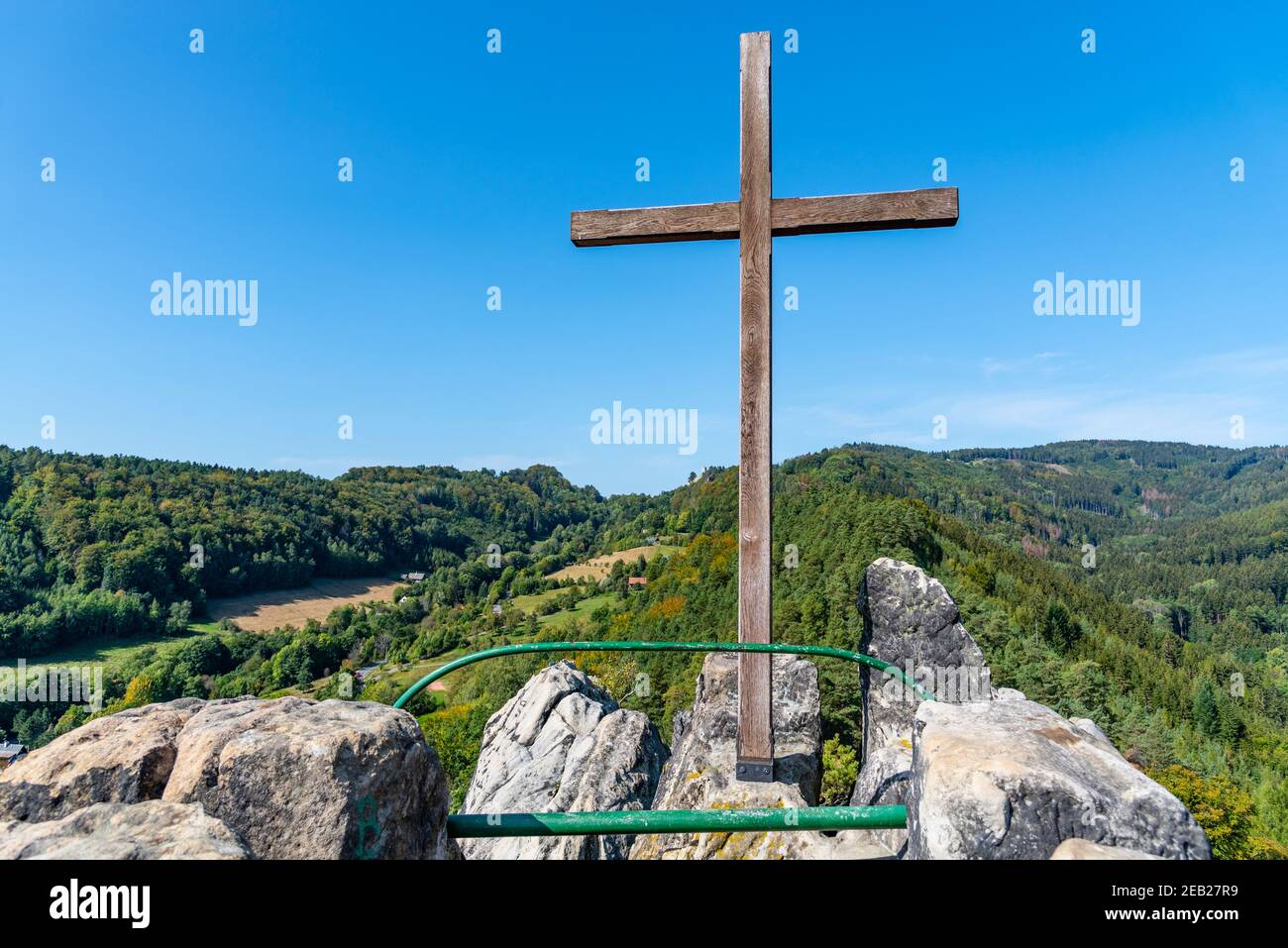 Wooden cross on the top rock Stock Photo - Alamy