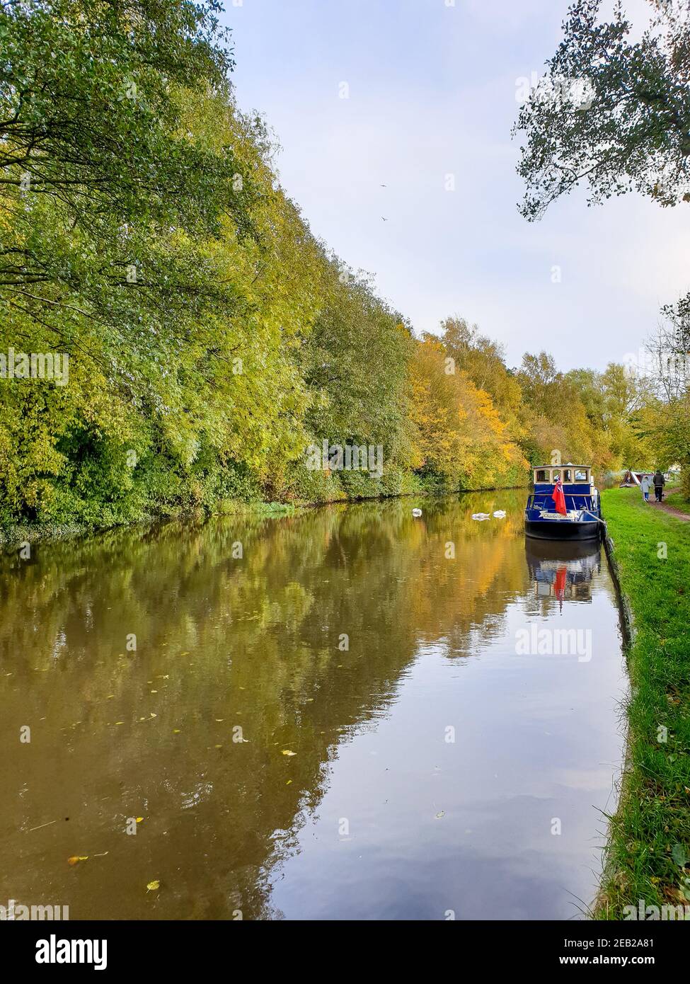 Barge, Narrowboat on canalside, canal path, autumn tree reflection ...
