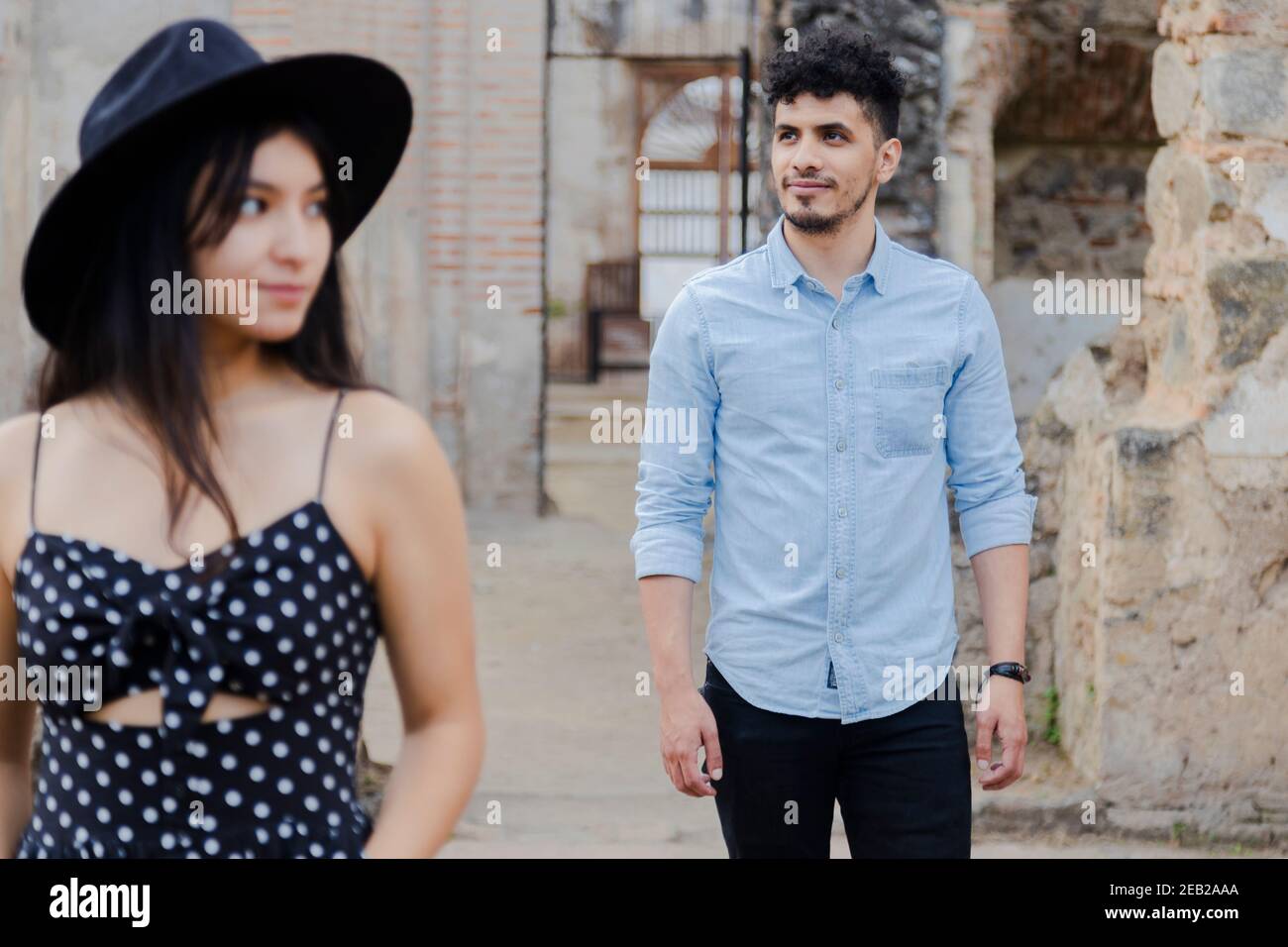 Creative portrait of Hispanic couple among famous ruins of Antigua ...
