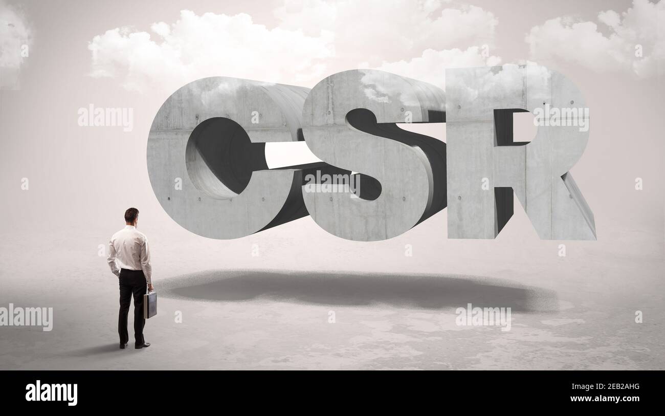 Rear view of a businessman standing in front of CSR abbreviation ...