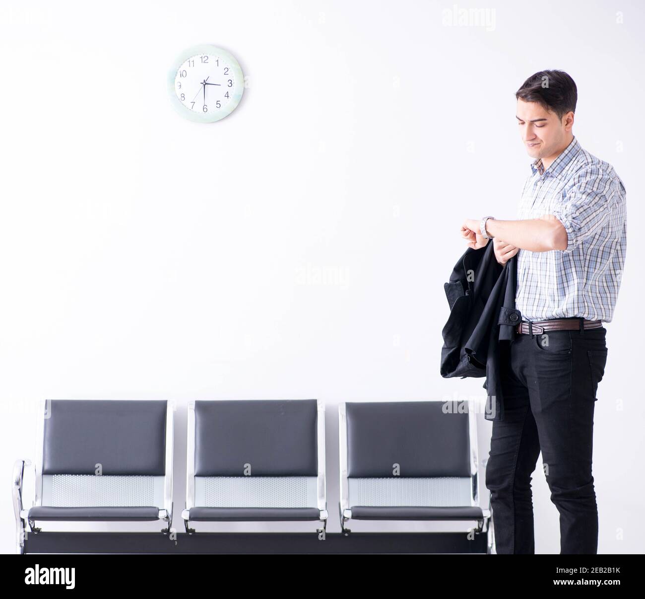 Frustrated businessman waiting in airport hi-res stock photography and ...