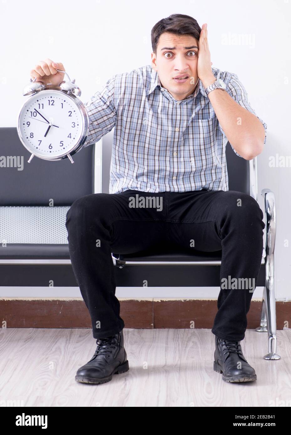The man nervously impatiently waiting in the lobby Stock Photo - Alamy