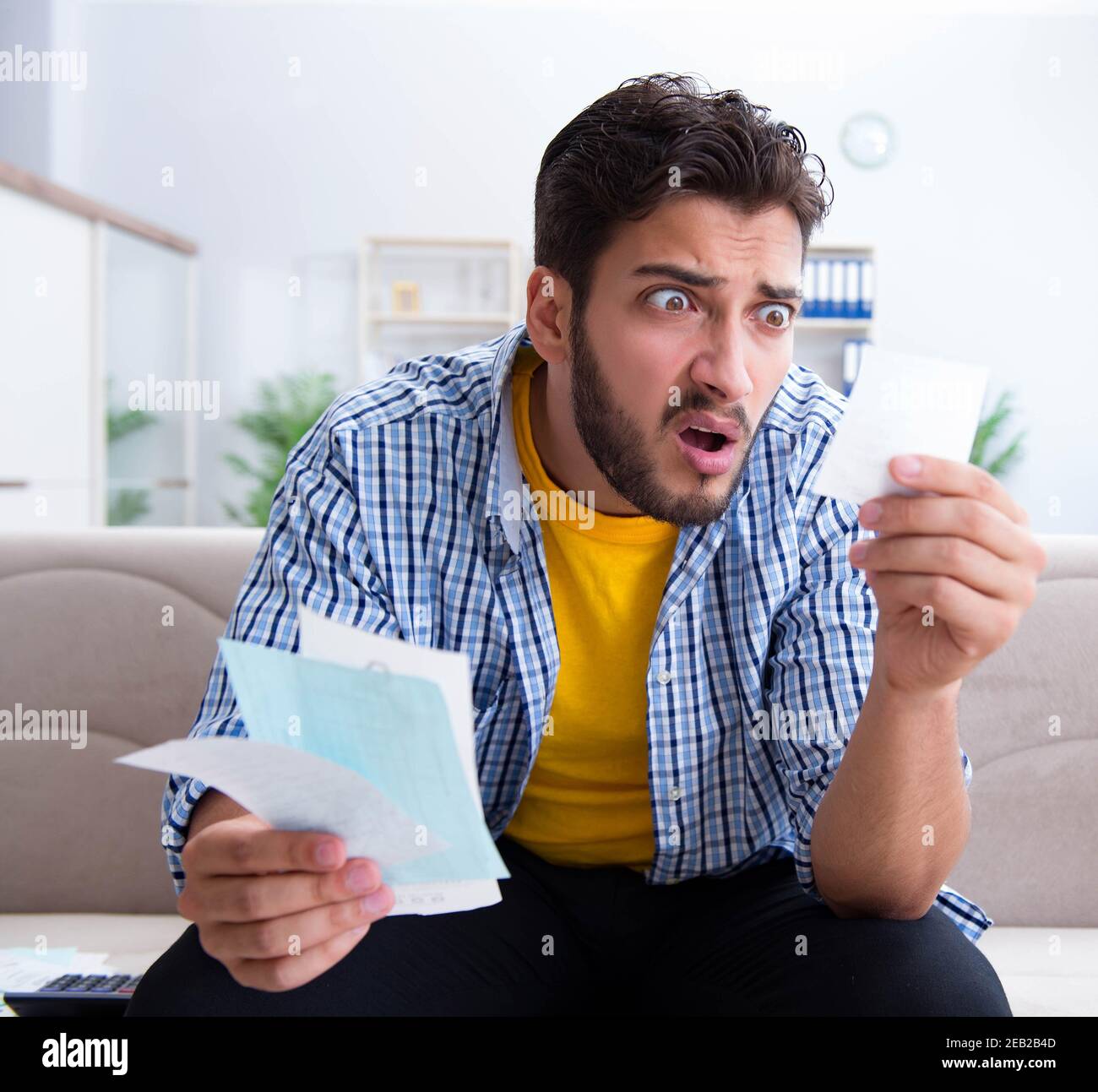The man angry at bills he needs to pay Stock Photo - Alamy