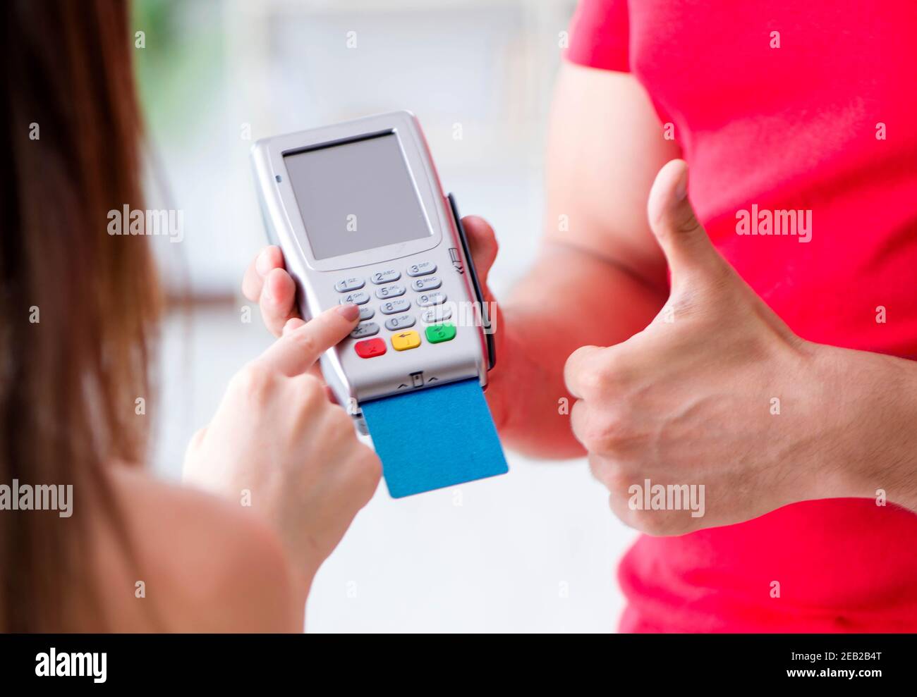 The concept of paying with pos terminal Stock Photo - Alamy
