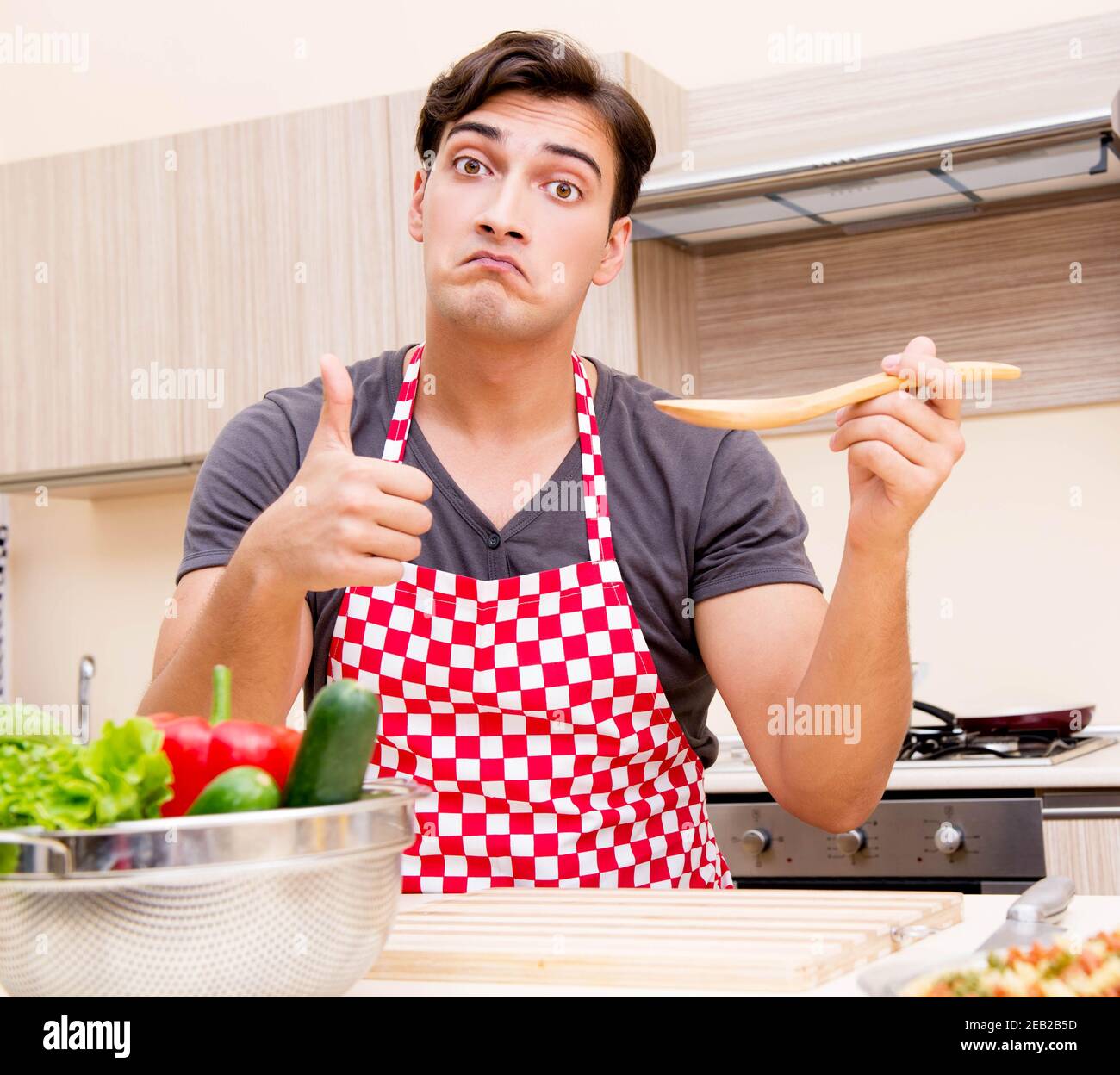 The man male cook preparing food in kitchen Stock Photo - Alamy
