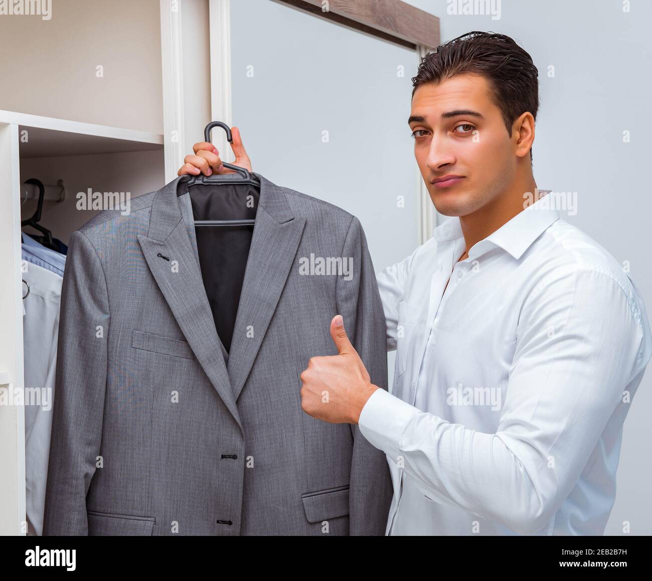 The businessman dressing up for work Stock Photo - Alamy