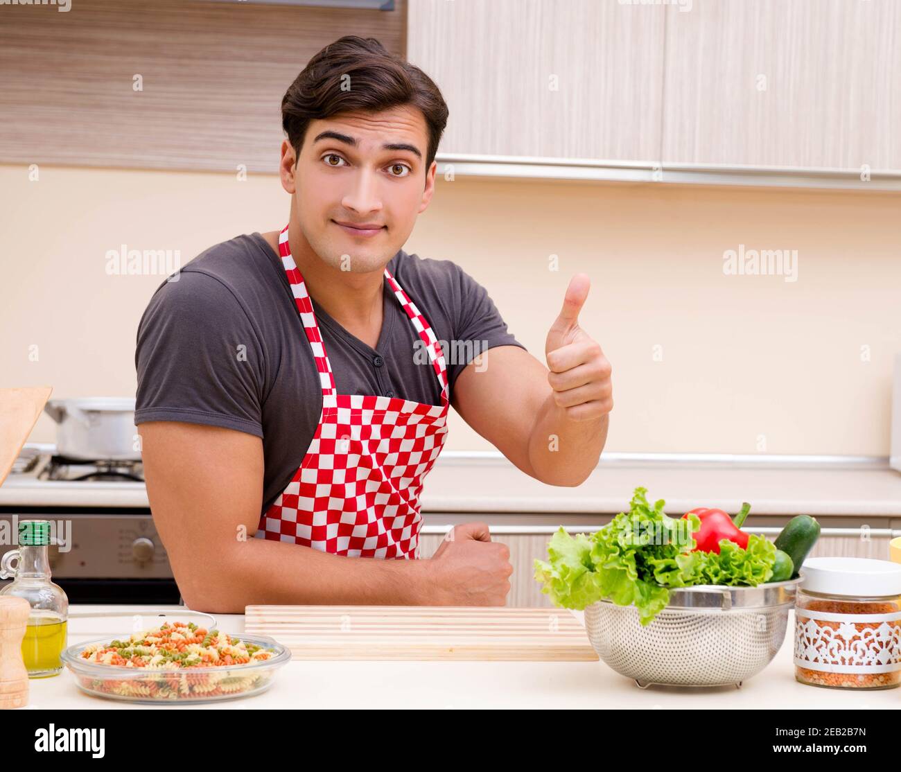The man male cook preparing food in kitchen Stock Photo - Alamy