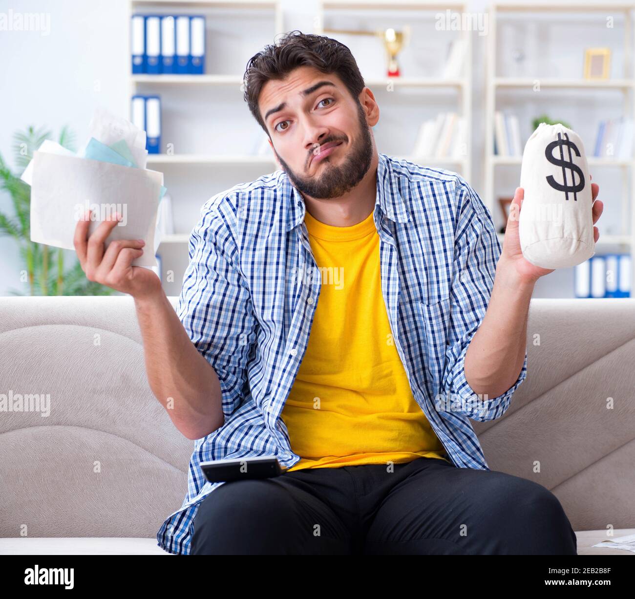 The man angry at bills he needs to pay Stock Photo - Alamy