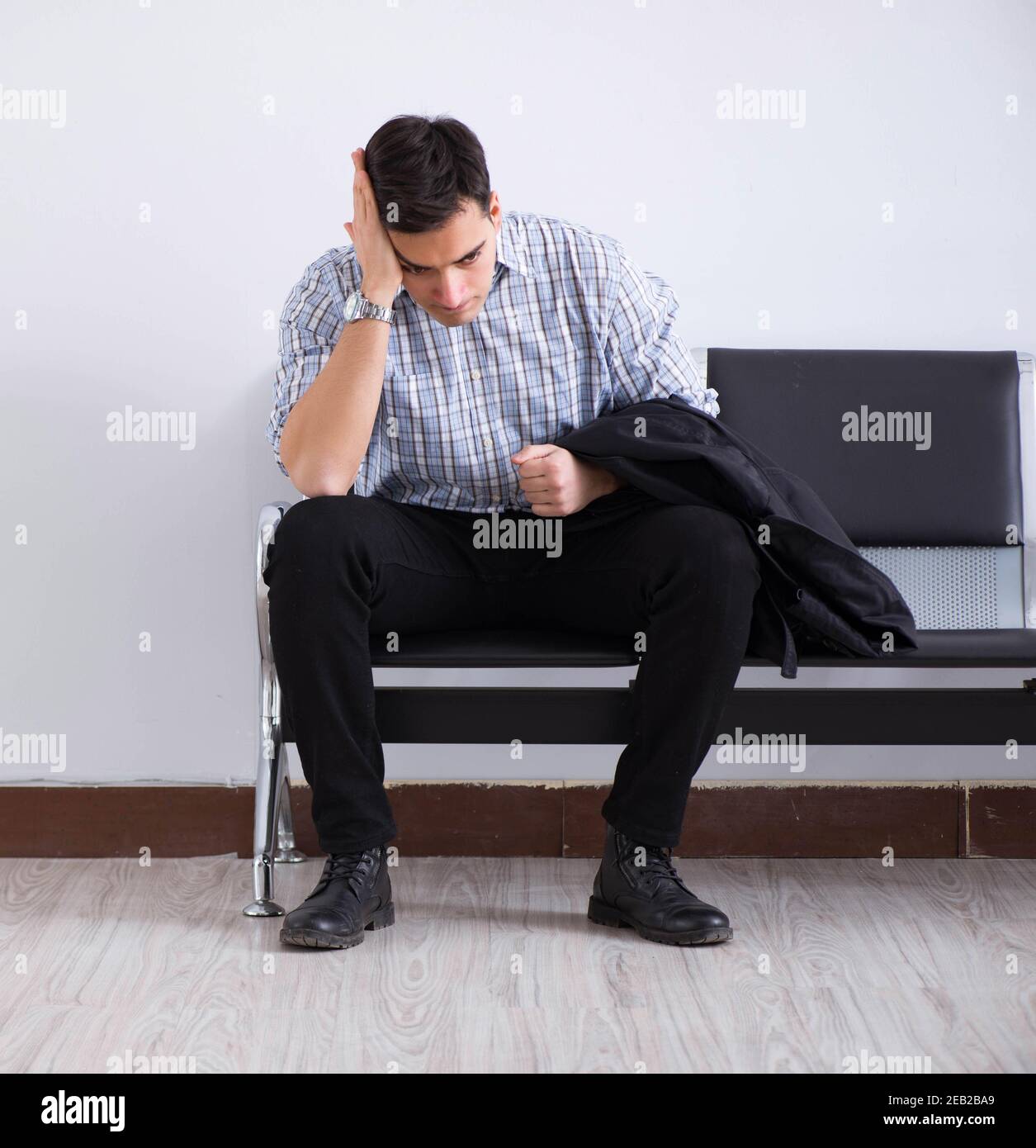 The man nervously impatiently waiting in the lobby Stock Photo - Alamy