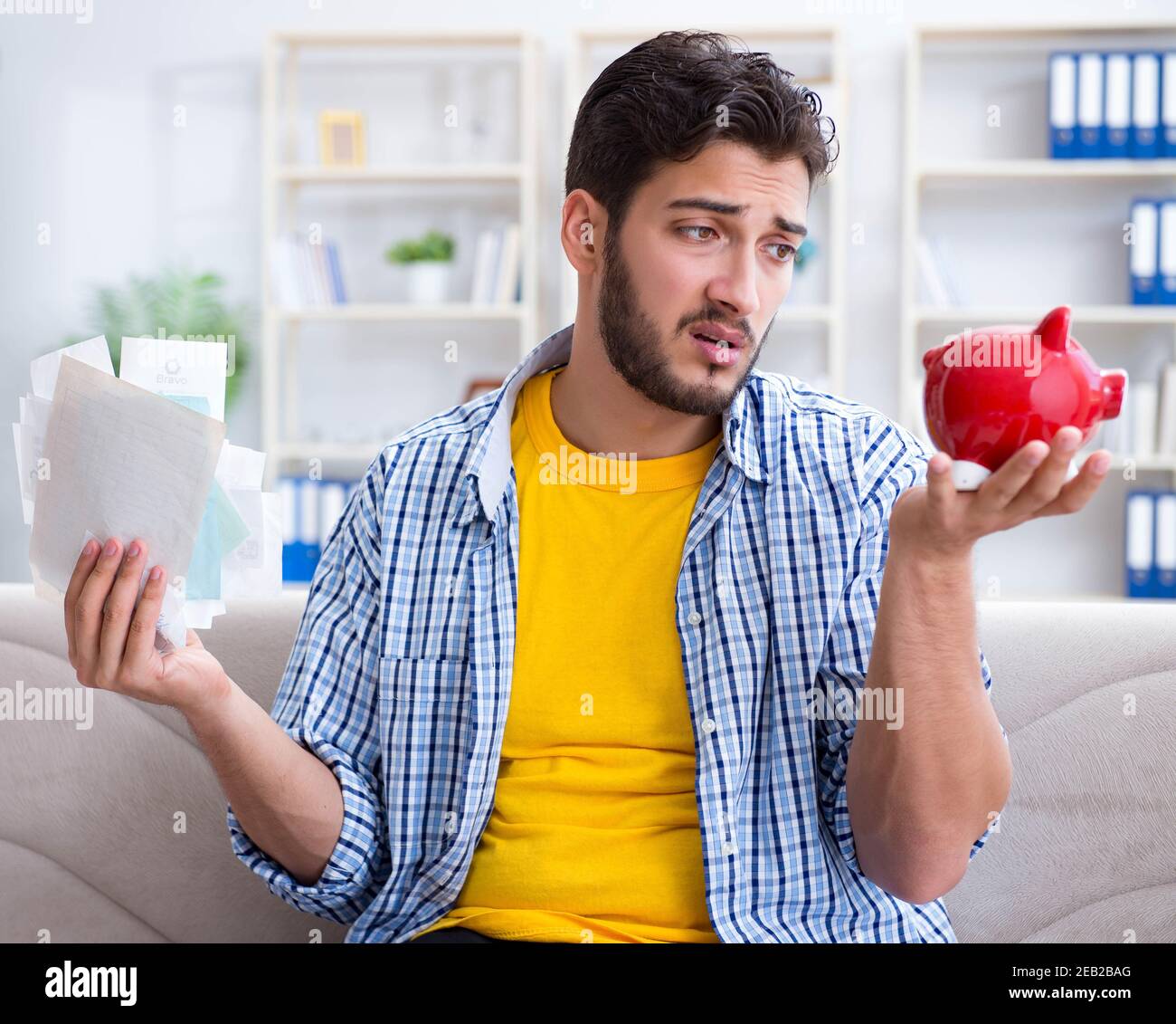 The man angry at bills he needs to pay Stock Photo - Alamy
