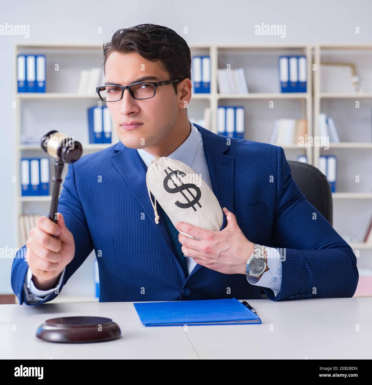 The judge in bribe concept with money Stock Photo - Alamy
