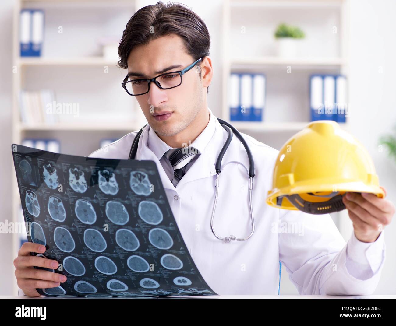 The safety doctor advising about wearing hard hat Stock Photo - Alamy