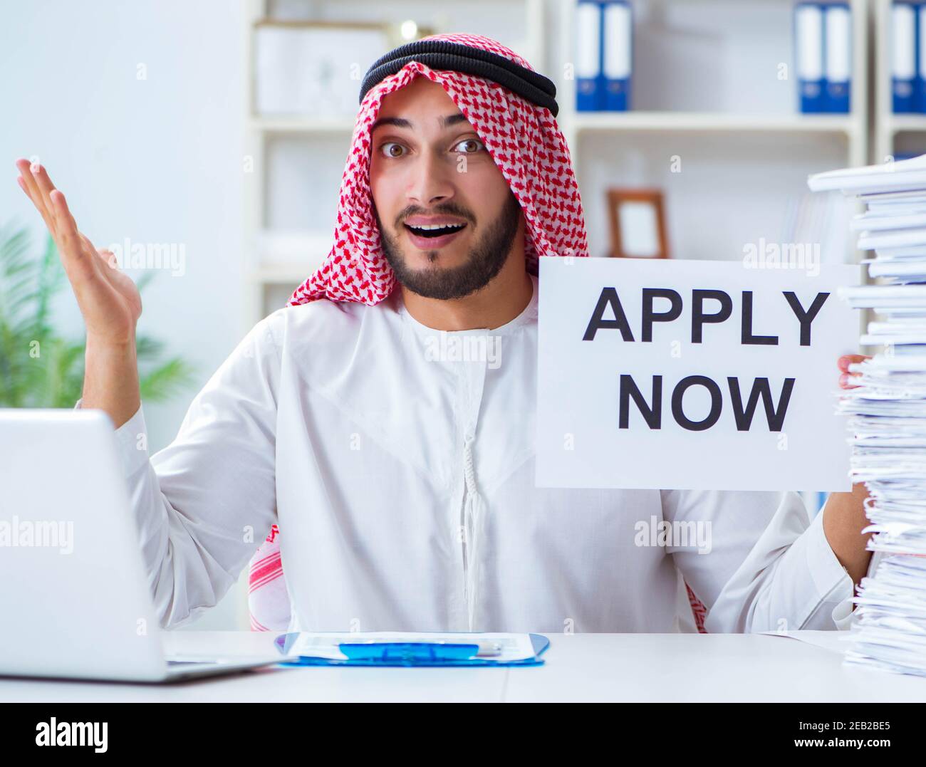 The arab man sitting at desk with message Stock Photo - Alamy