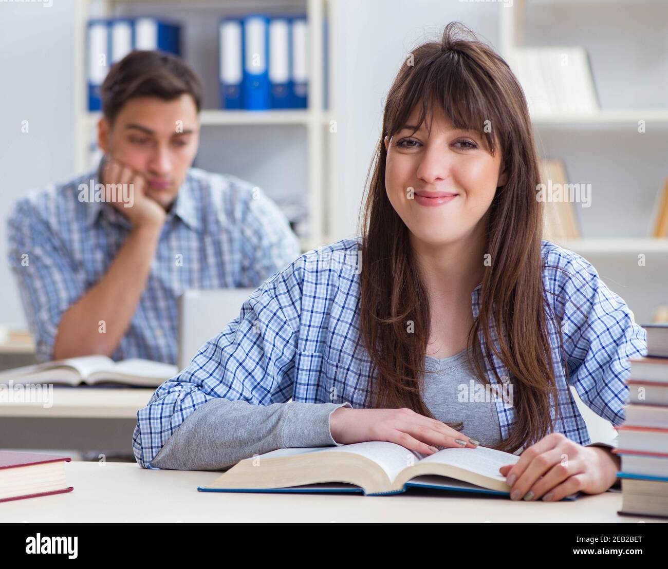 The students sitting and studying in classroom college Stock Photo - Alamy
