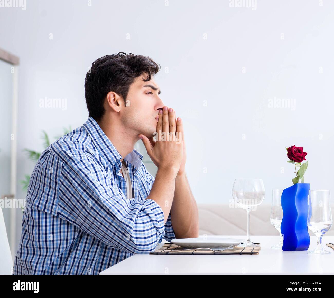 The man alone preparing for romantic date with his sweetheart Stock ...