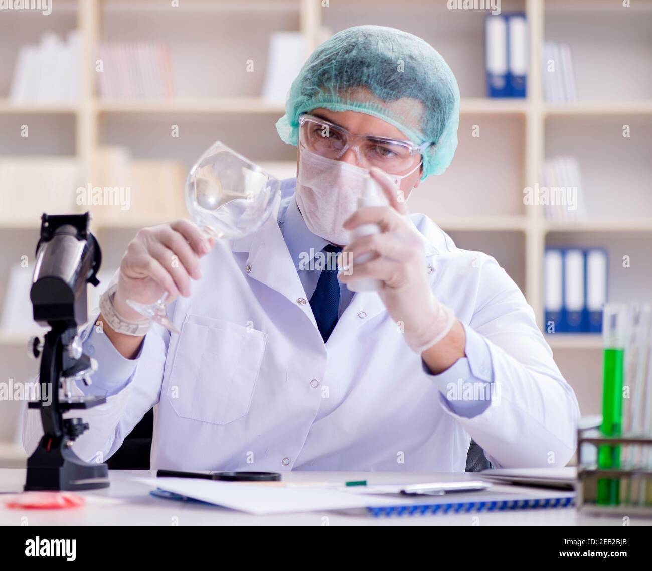 Forensic scientist analysing dna hi-res stock photography and images ...