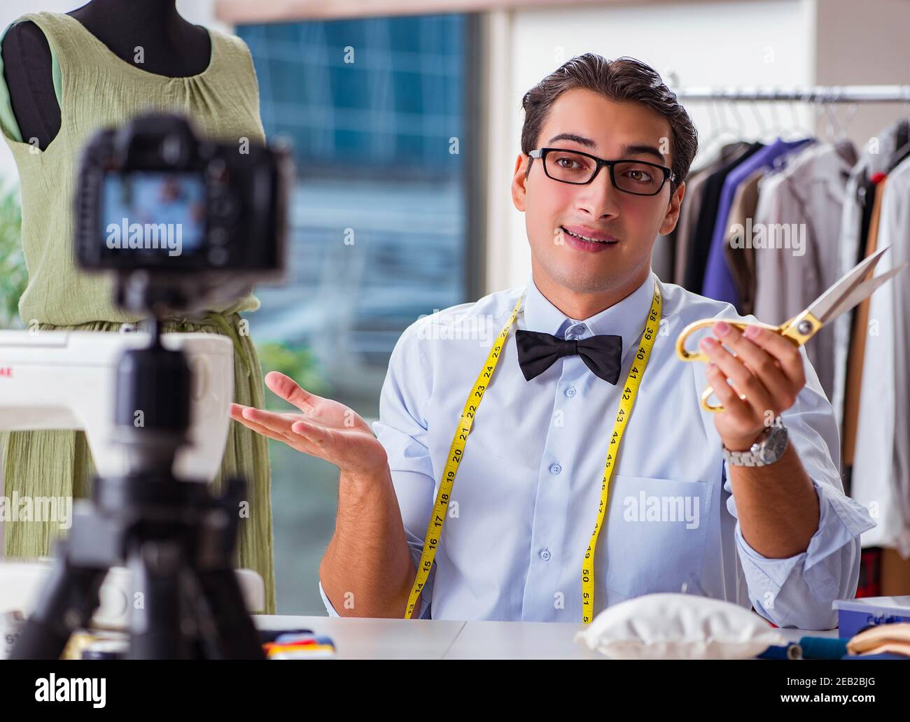 The young man working as fashion video blogger Stock Photo - Alamy
