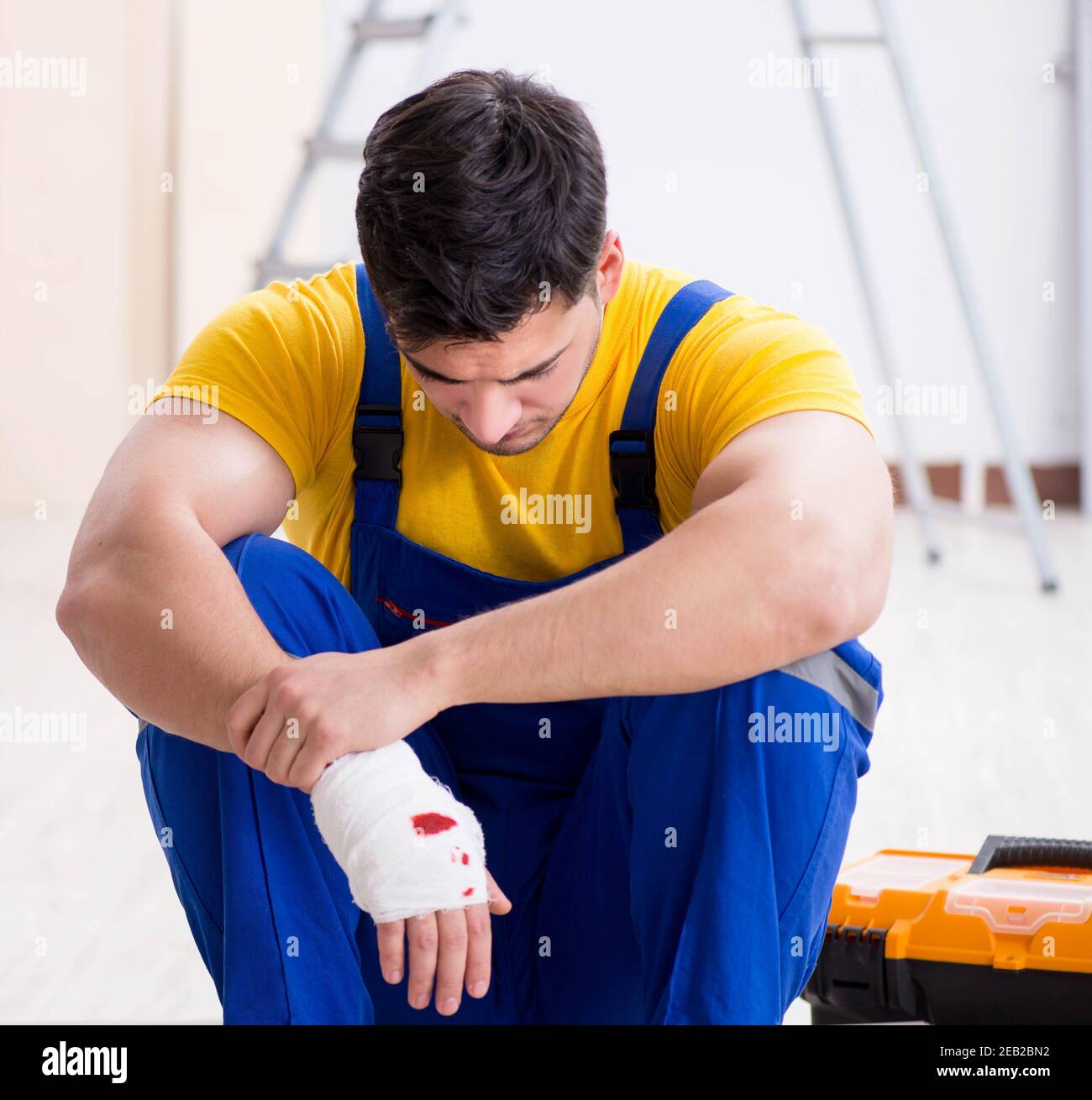 The worker with injured hand at construction site Stock Photo - Alamy