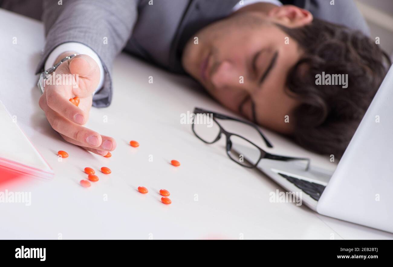 The employee commited suicide with pills Stock Photo - Alamy