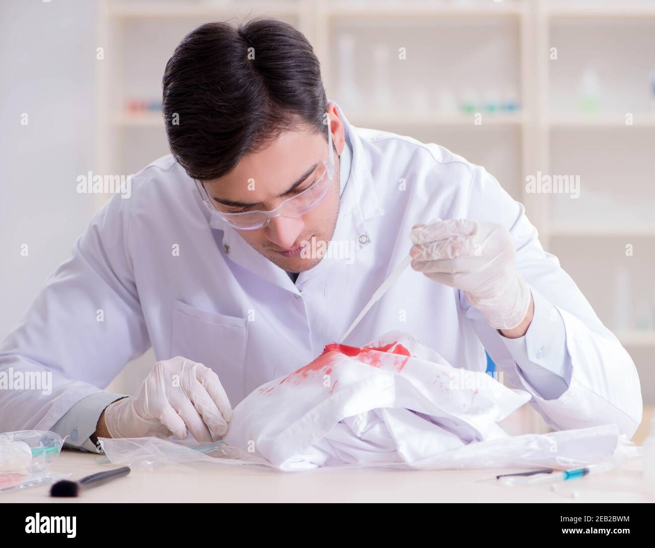 The expert criminologist working in the lab for evidence Stock Photo ...