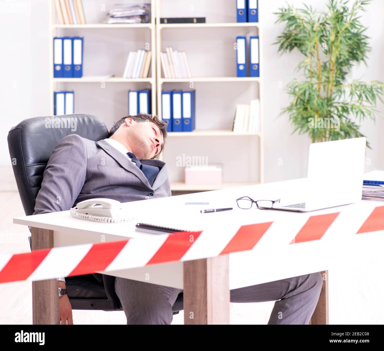 The dead businessman at this desk Stock Photo - Alamy