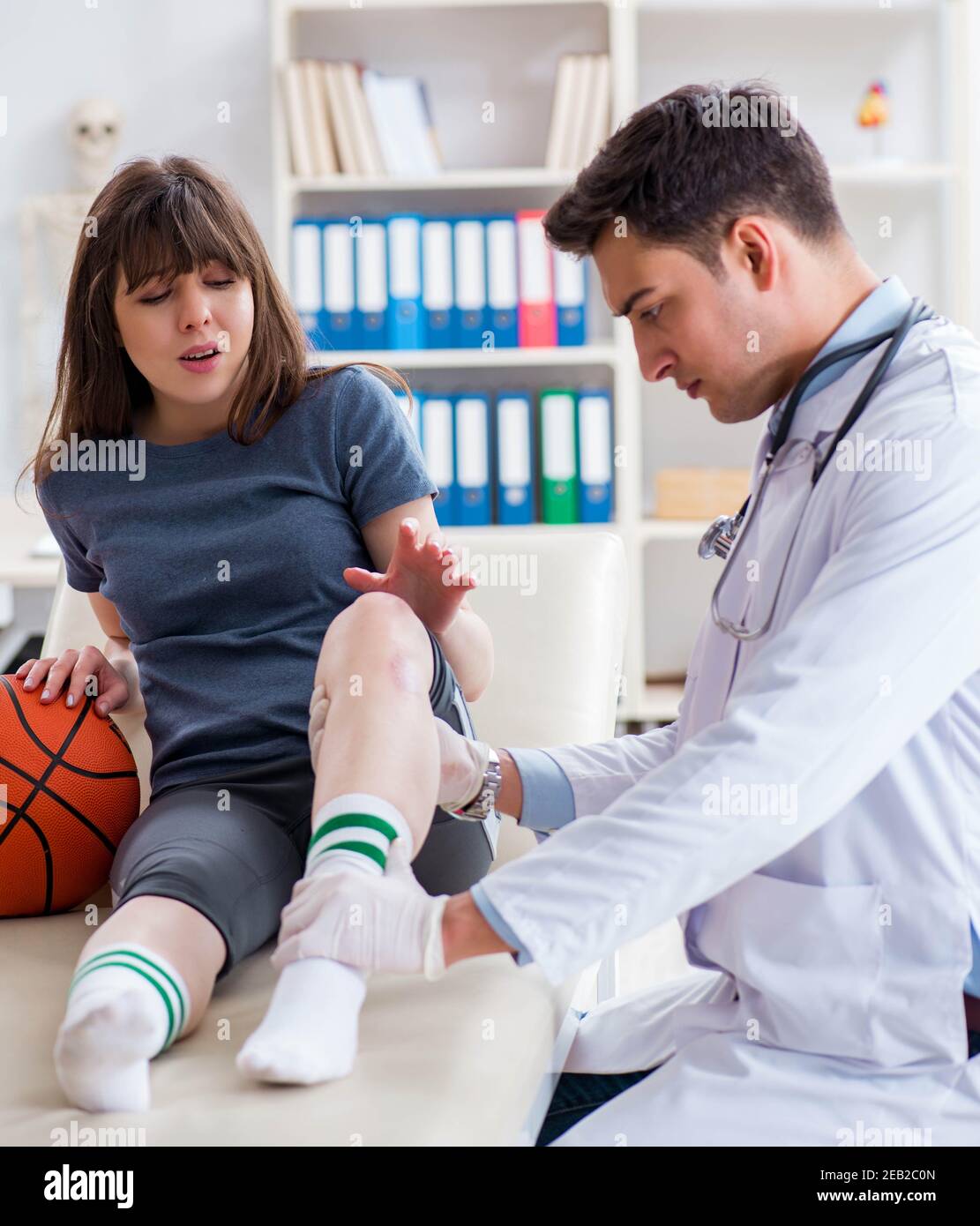 The female basketball player visiting doctor after injury Stock Photo ...