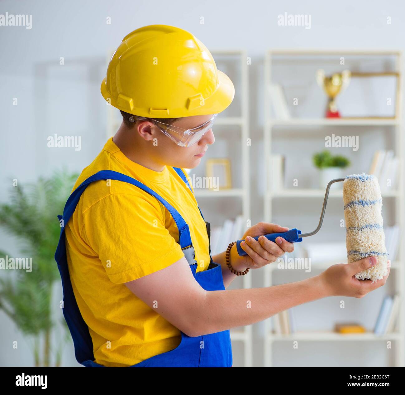 The painter working at home in refurbishment project Stock Photo - Alamy