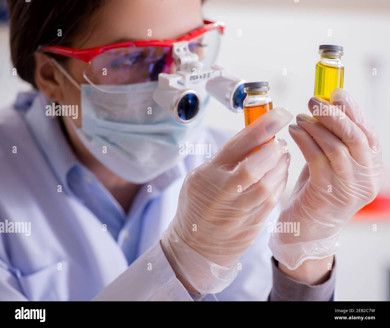 The lab assistant in drug synthesis concept Stock Photo - Alamy