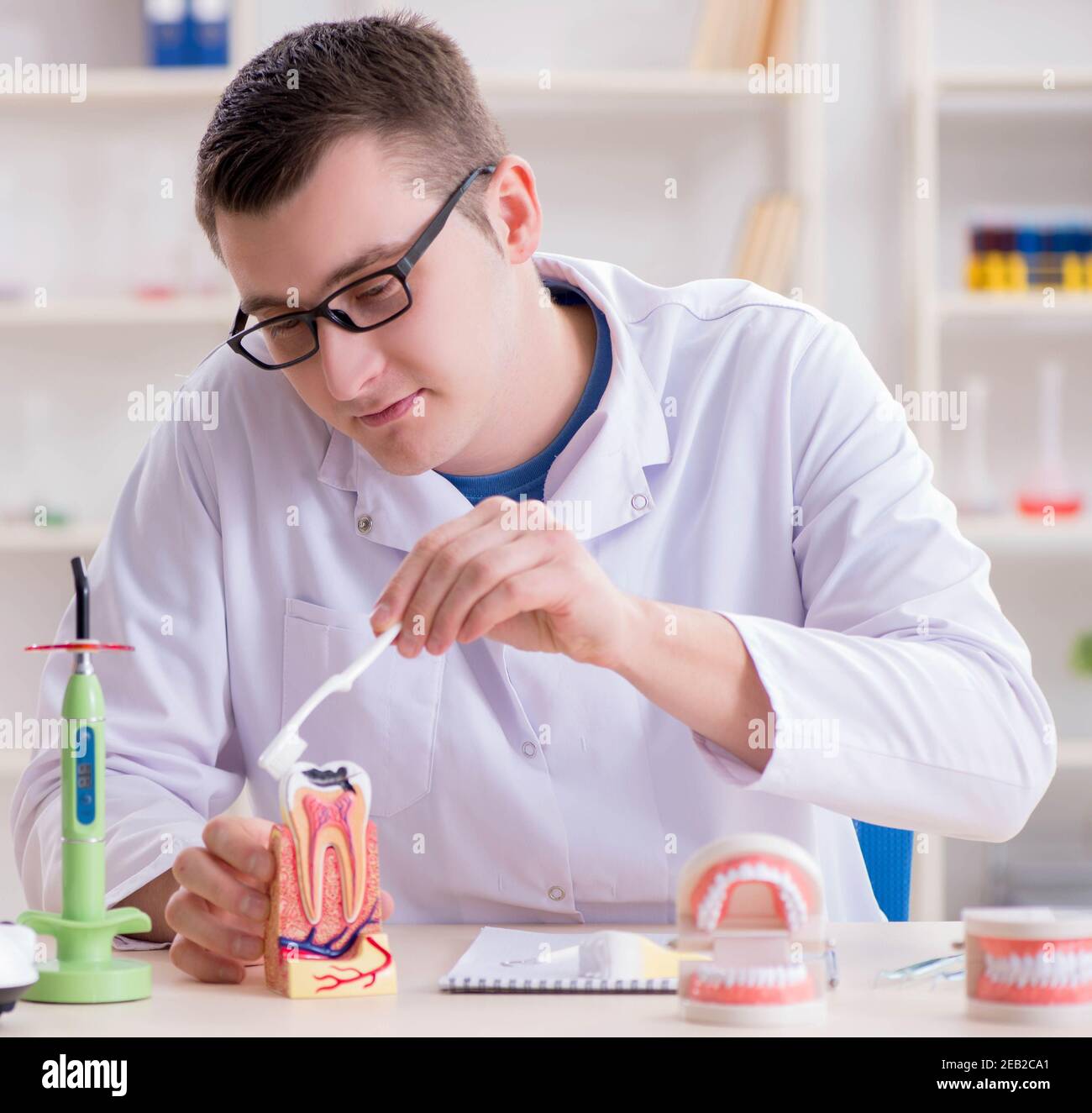 The dentist working teeth implant in medical lab Stock Photo - Alamy