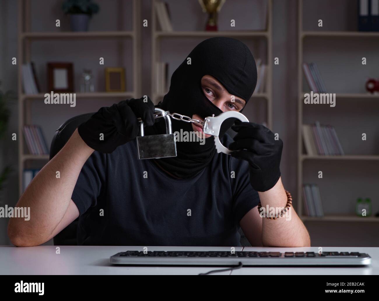 The hacker hacking computer late at night Stock Photo - Alamy