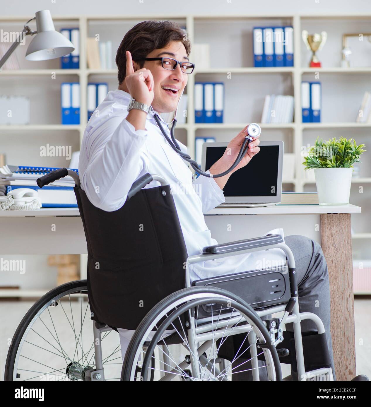 The disabled doctor on wheelchair working in hospital Stock Photo - Alamy