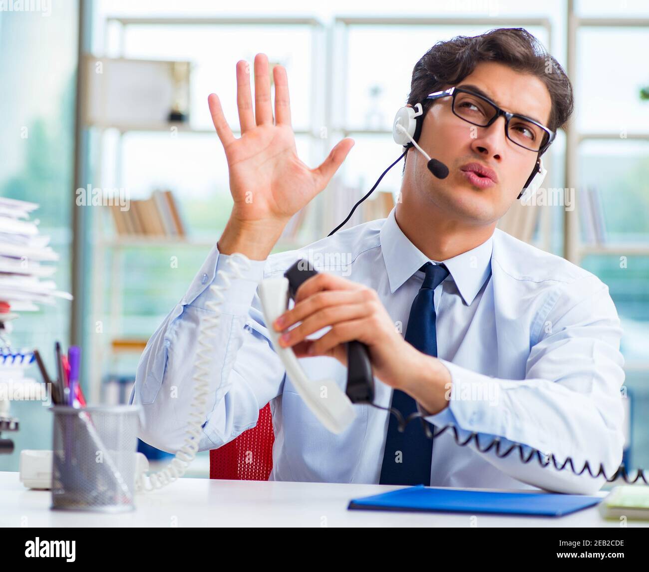 The unhappy angry call center worker frustrated with workload Stock ...