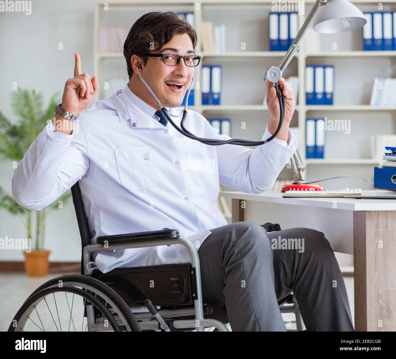 The disabled doctor on wheelchair working in hospital Stock Photo - Alamy