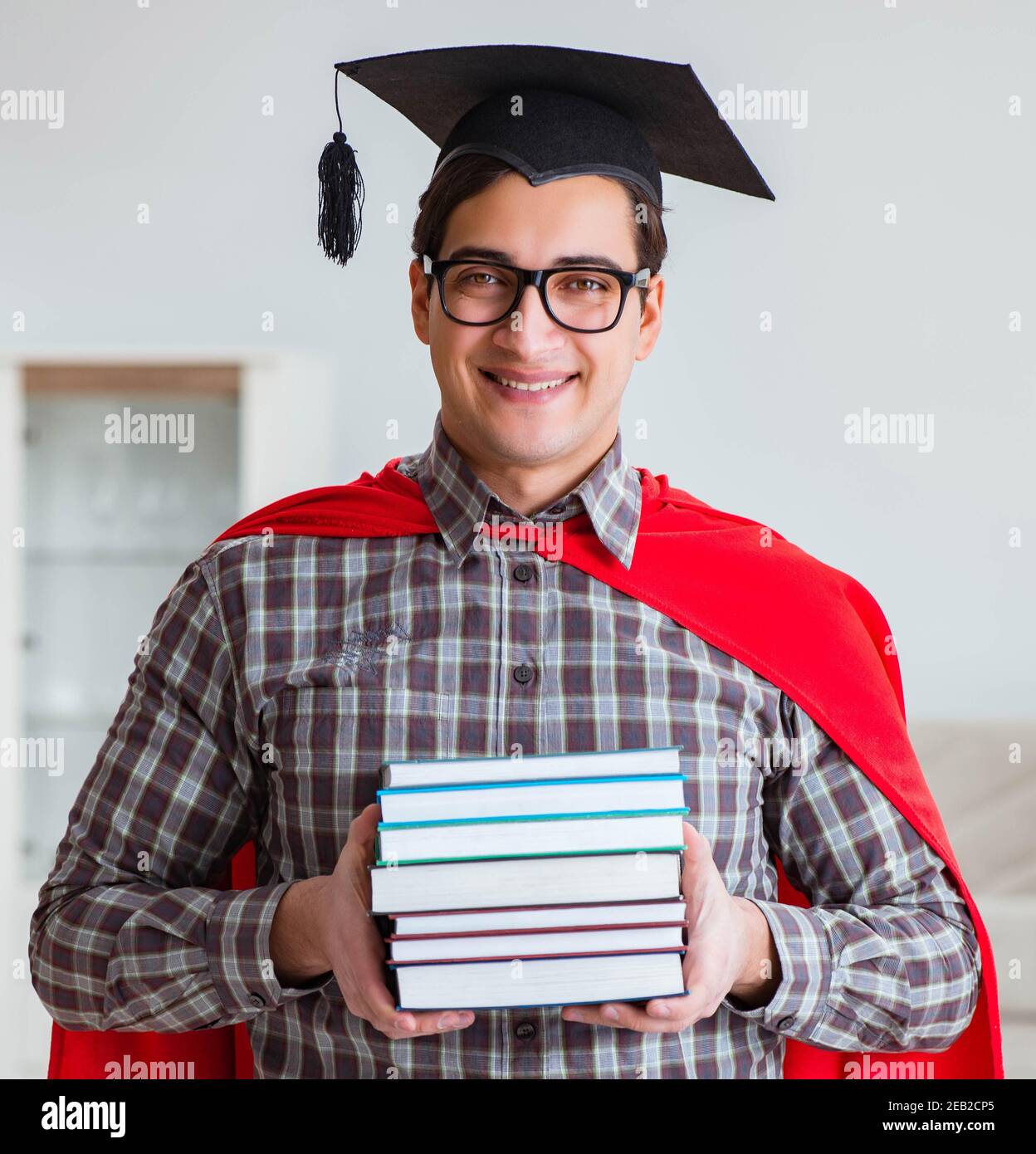 The super hero student with books studying for exams Stock Photo - Alamy