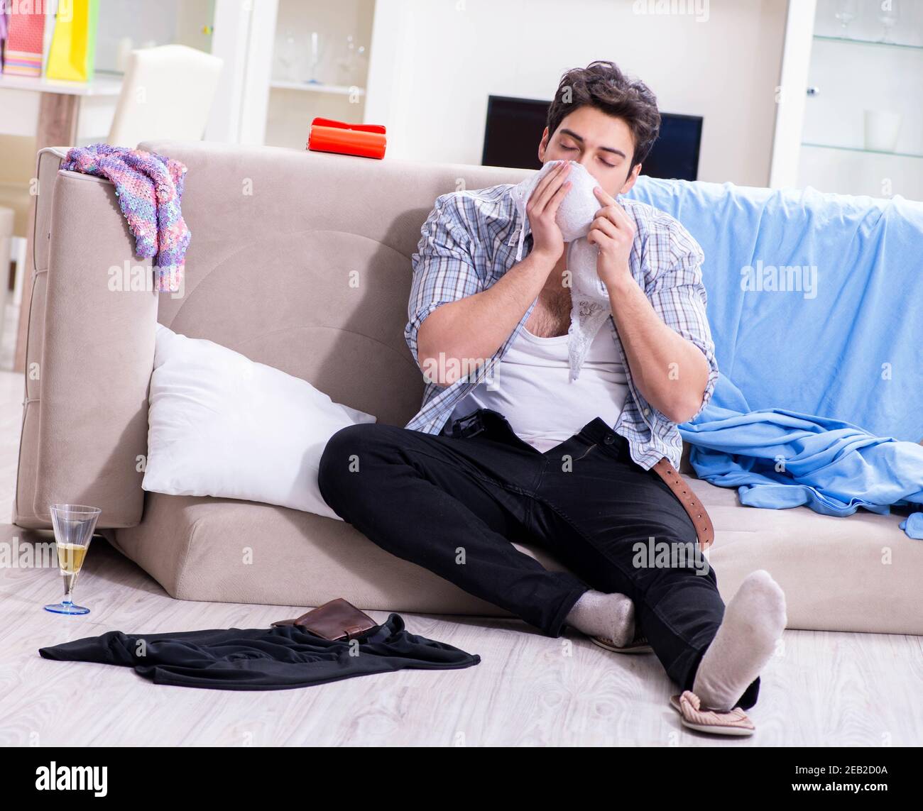 The man with mess at home after house party Stock Photo - Alamy