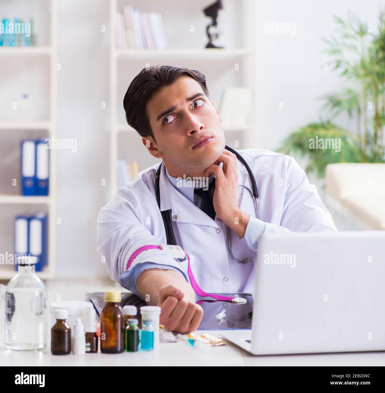 The doctor drug addict in the hospital Stock Photo - Alamy