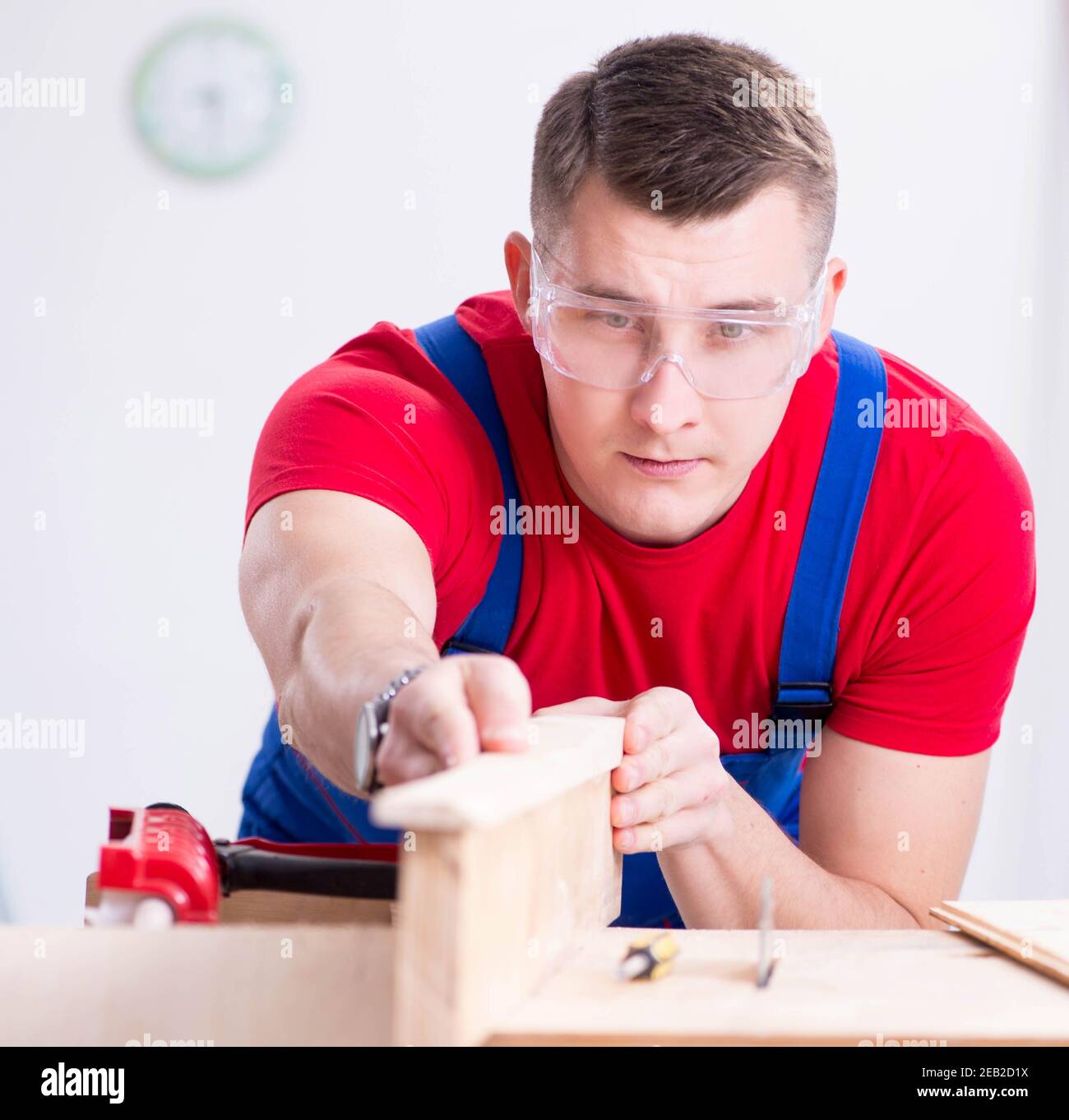 The contractor working in the workshop Stock Photo - Alamy