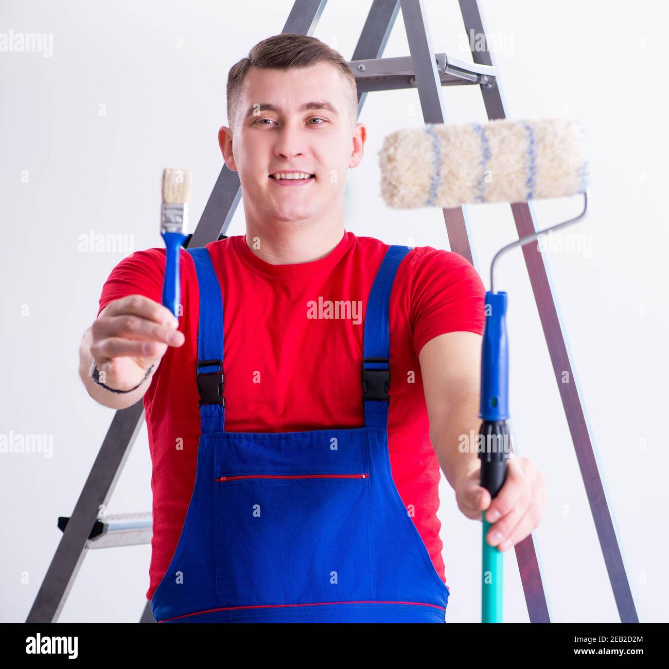 The male painter preparing for painting job at construction site Stock ...