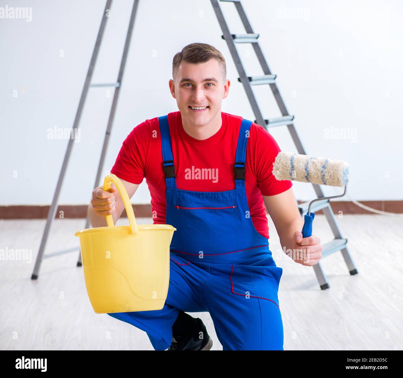 The male painter preparing for painting job at construction site Stock ...