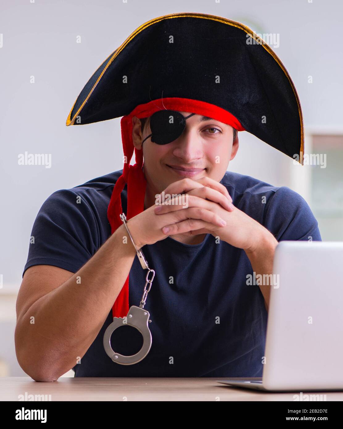 The digital security concept with pirate at computer Stock Photo - Alamy