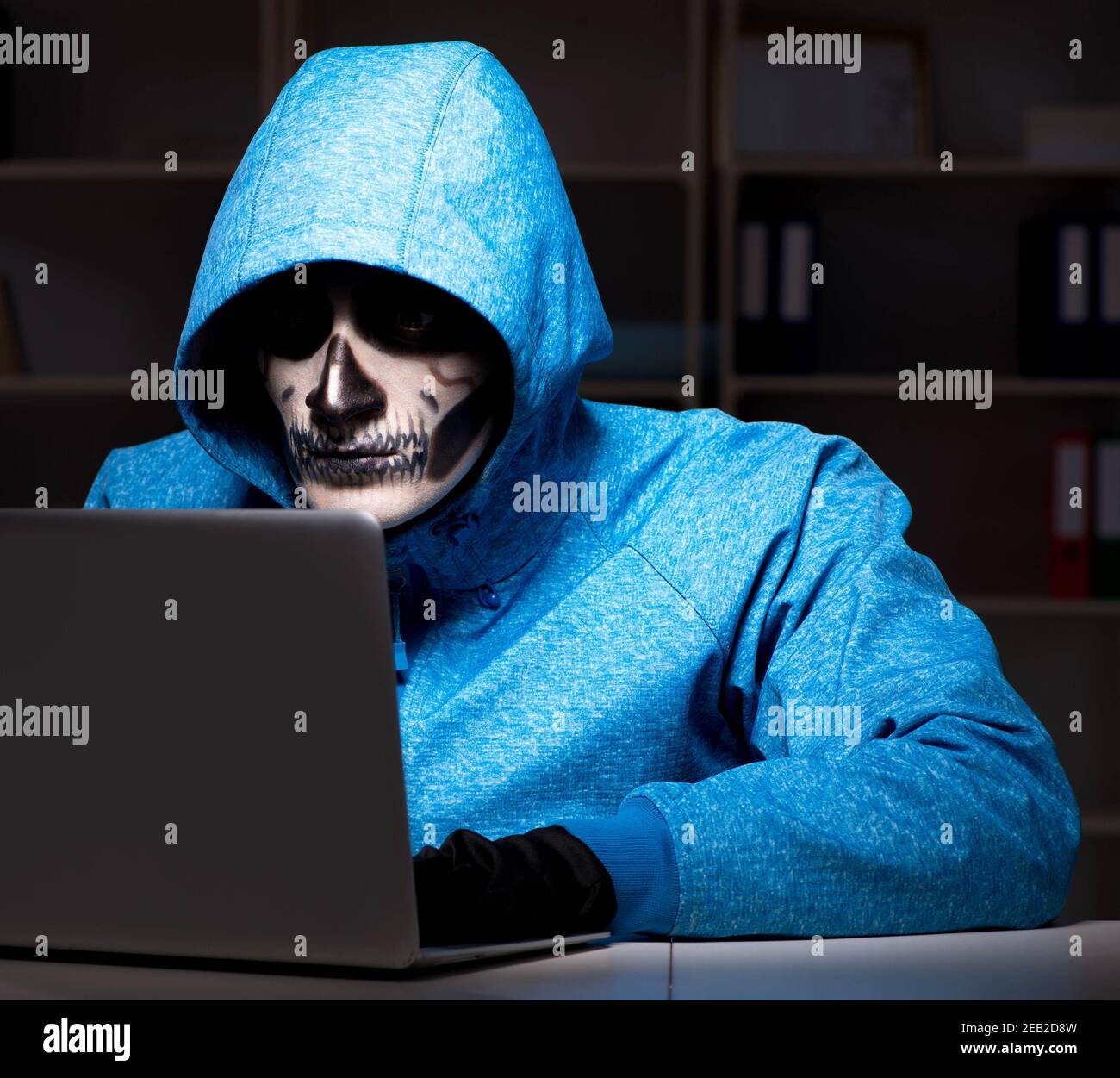 The scary hacker hacking security firewall late in office Stock Photo ...