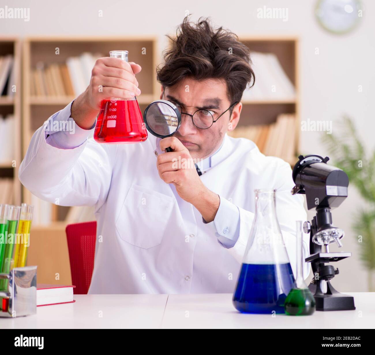The mad crazy scientist doctor doing experiments in a laboratory Stock ...