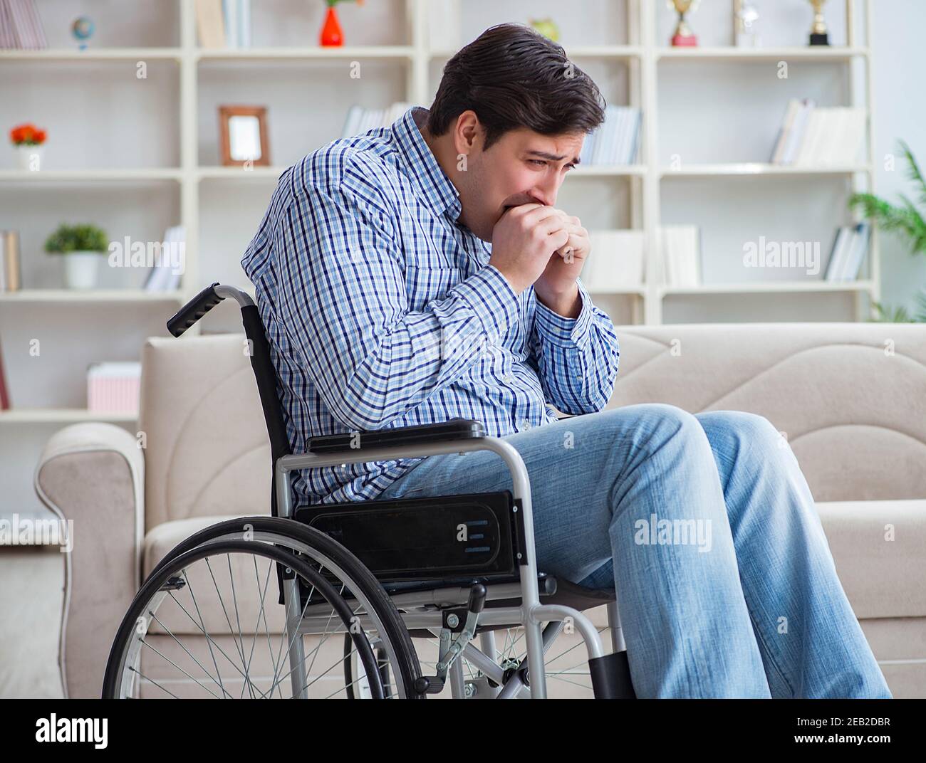 The disabled young man suffering at home Stock Photo - Alamy