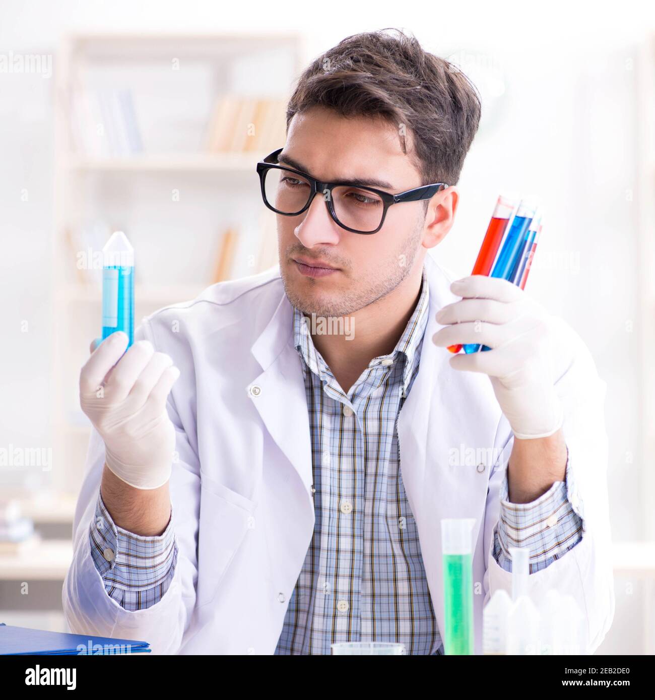 Chemistry student doing chemical experiments at classroom activity ...