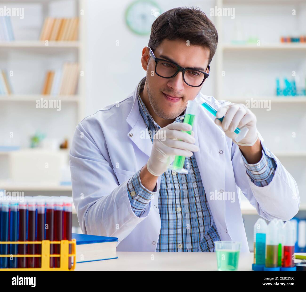 The young chemist student working in lab on chemicals Stock Photo - Alamy