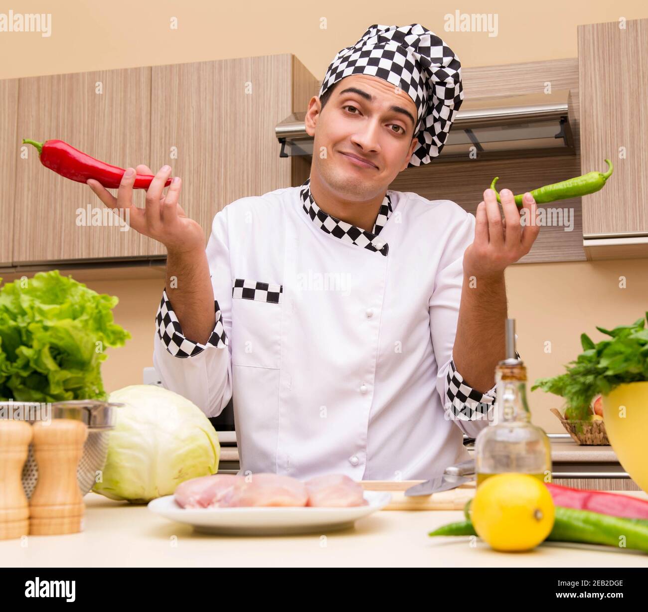 The young chef working in the kitchen Stock Photo - Alamy
